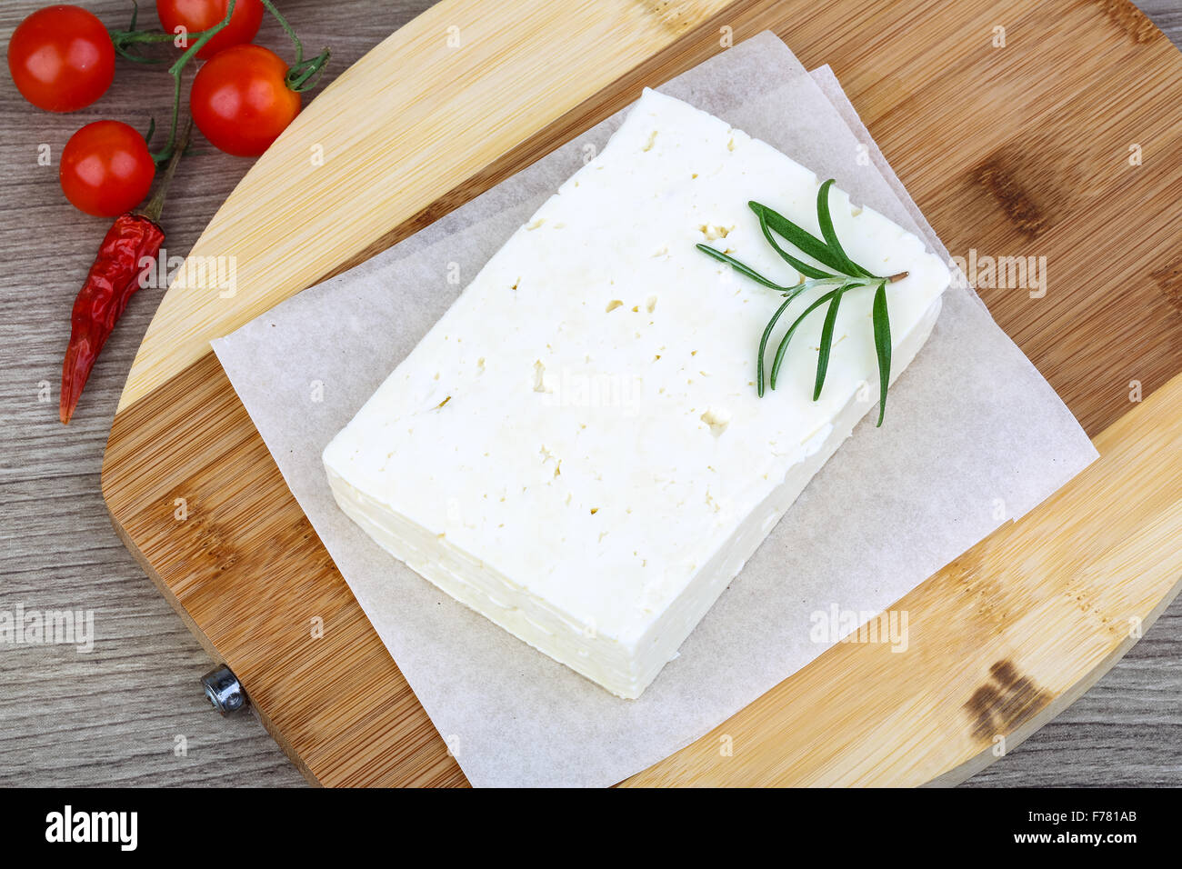 Traditional Caucasian homemade Cheese Brinza with rosemary on wood ...