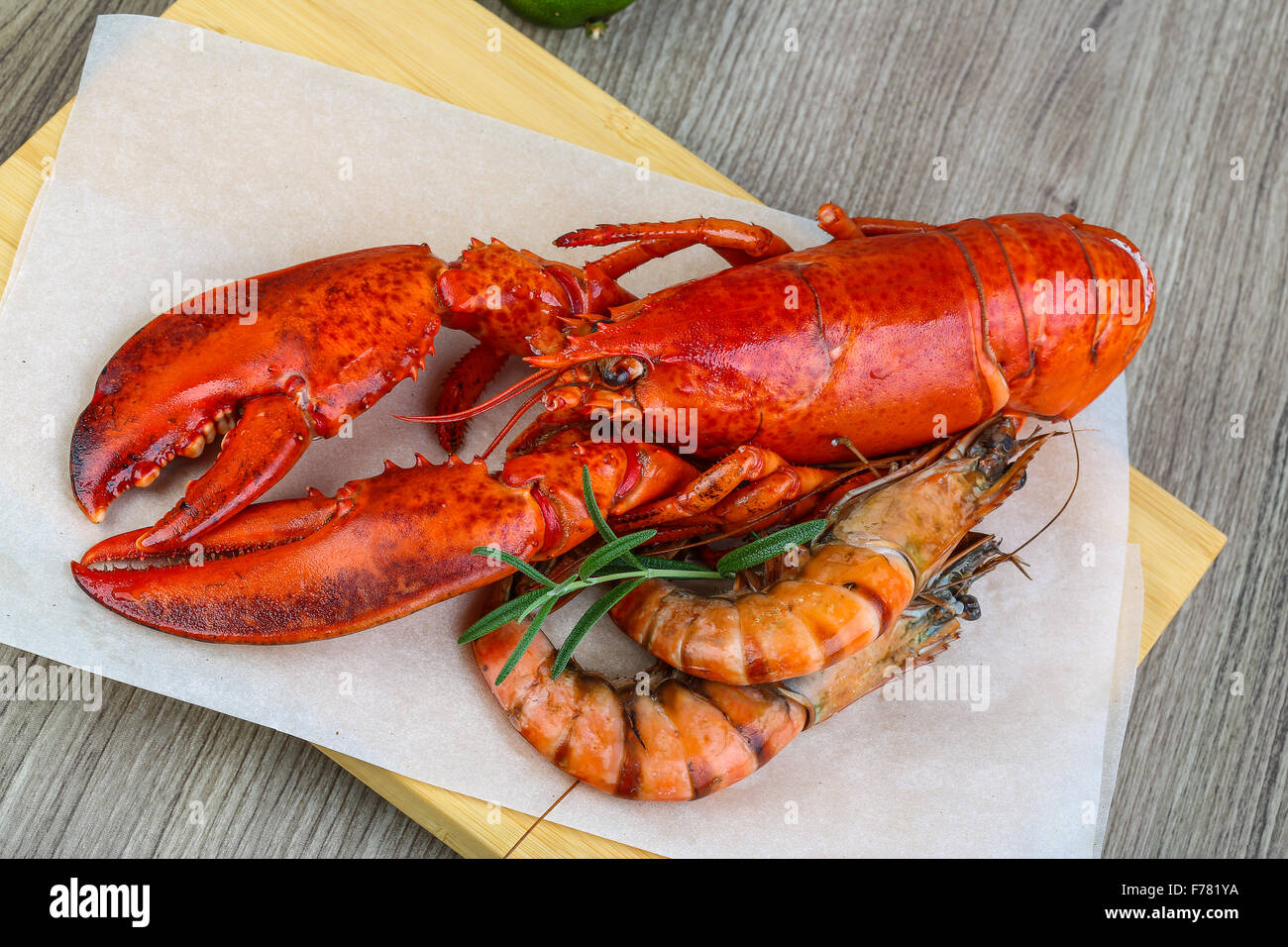 Big cooked lobster and tiger shrimps ready for eating Stock Photo - Alamy
