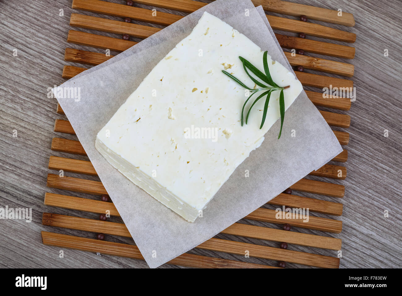 Traditional Caucasian homemade Cheese Brinza with rosemary on wood ...
