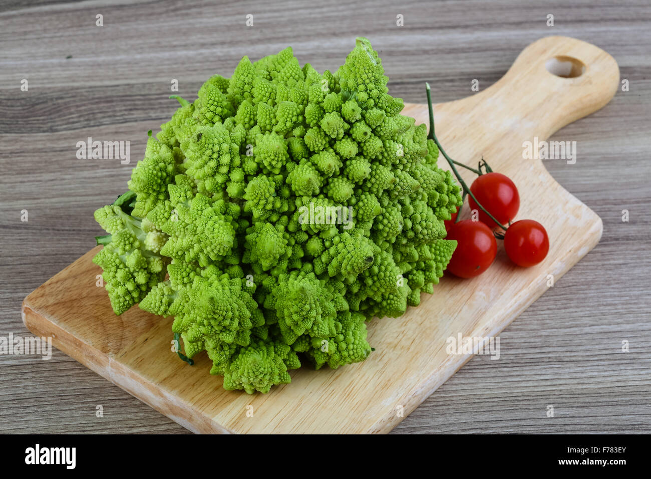 Romanesco exotic cabbage on the wood background Stock Photo - Alamy