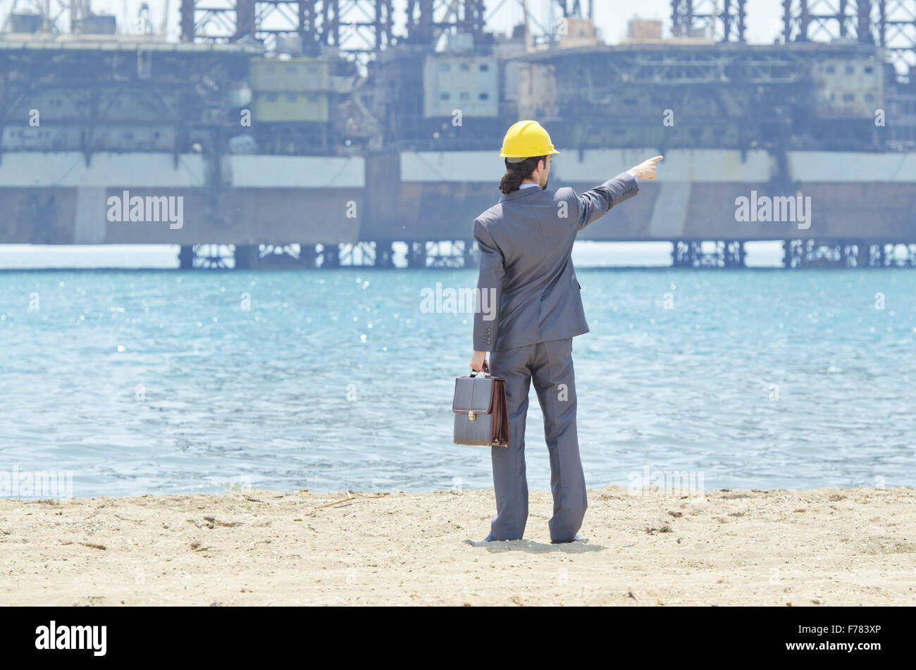 Oil engineer on sea side beach Stock Photo - Alamy