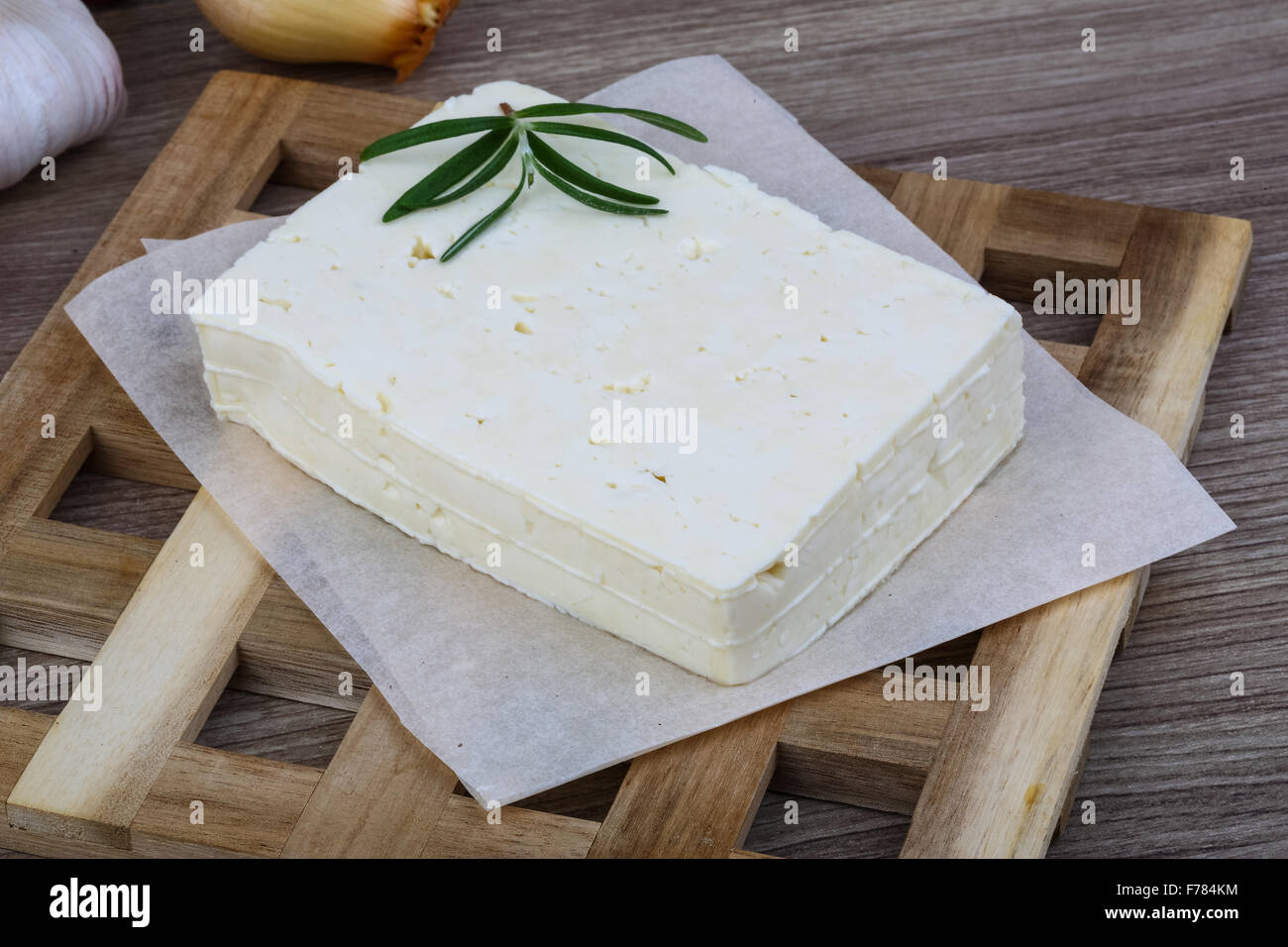 Traditional Caucasian homemade Cheese Brinza with rosemary on wood ...