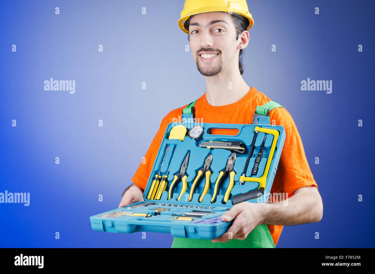Repairman with his toolkit Stock Photo - Alamy
