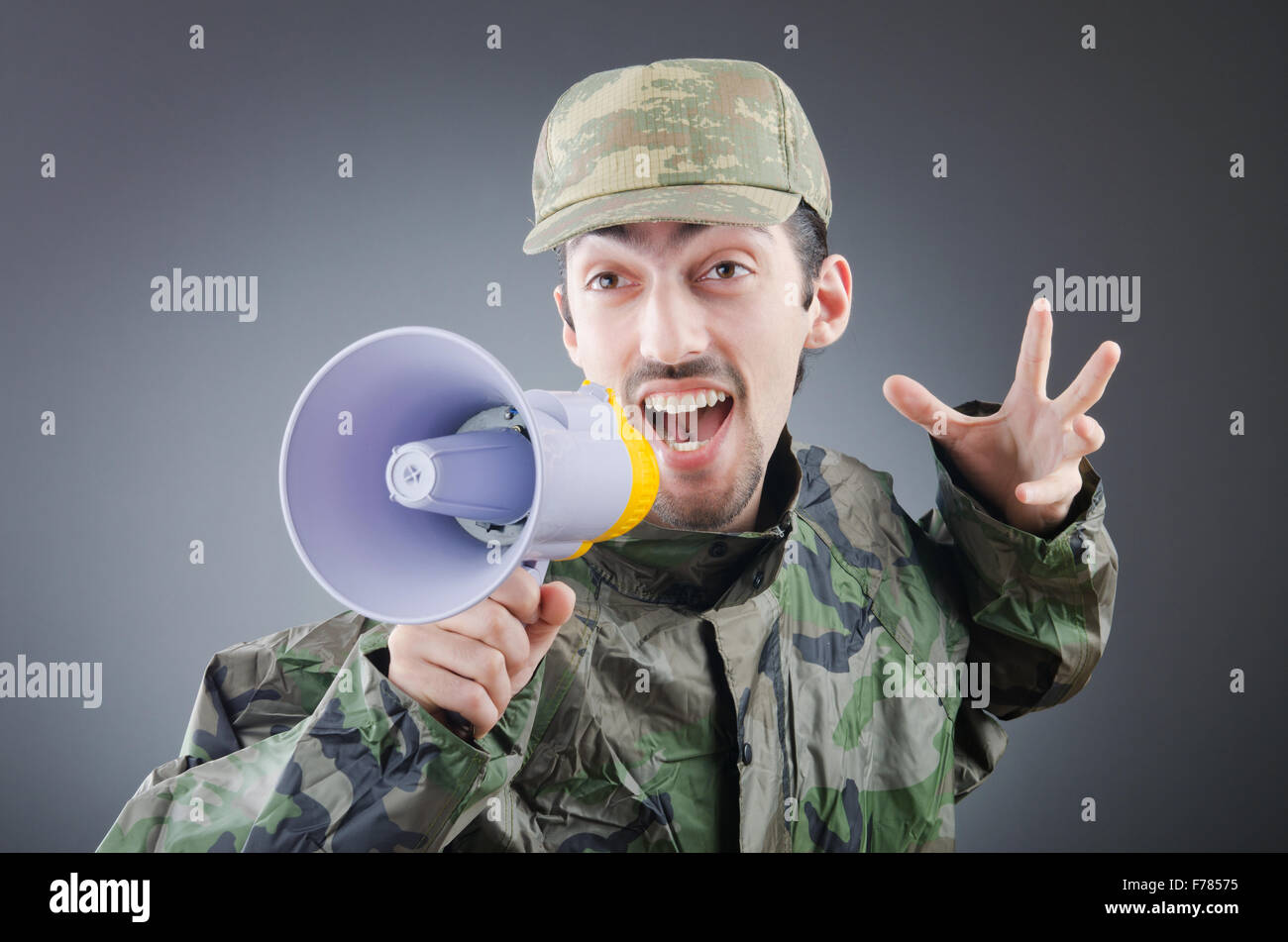 Soldier with loudspeaker shouting Stock Photo - Alamy