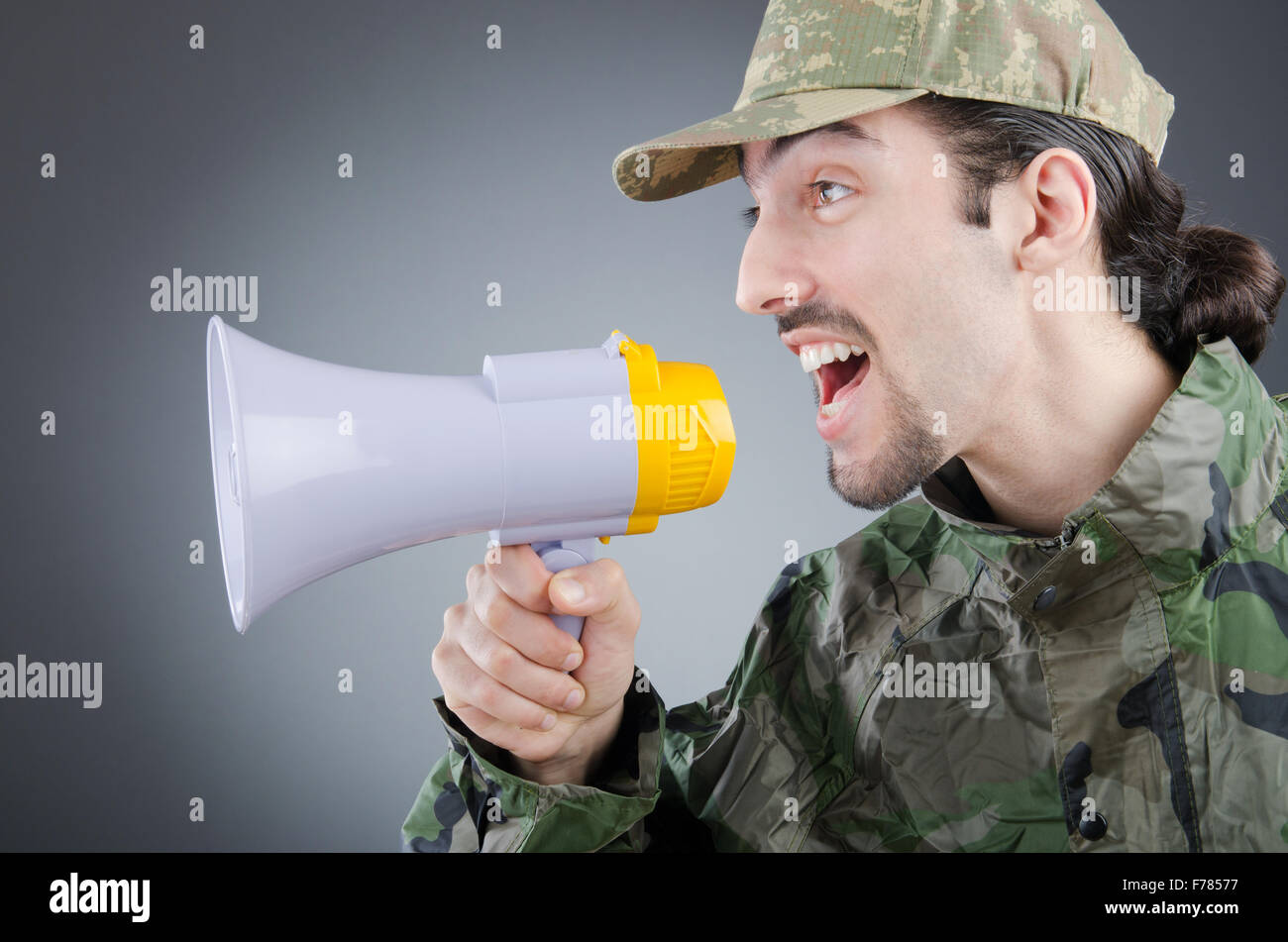Soldier with loudspeaker shouting Stock Photo - Alamy