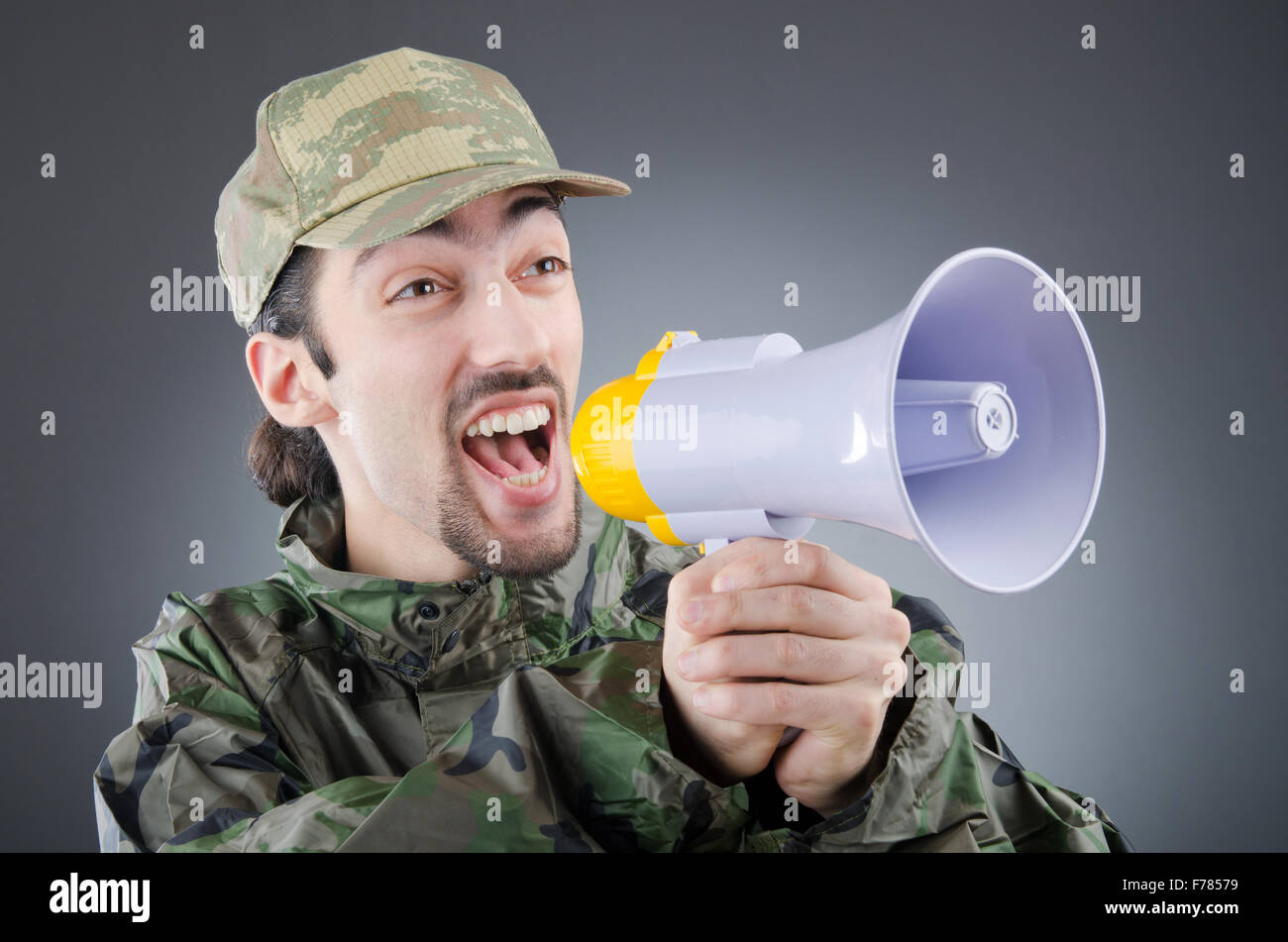 Soldier with loudspeaker shouting Stock Photo - Alamy