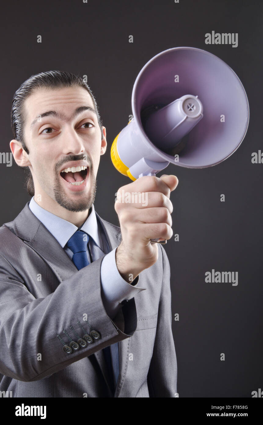 Man shouting and yelling with loudspeaker Stock Photo - Alamy