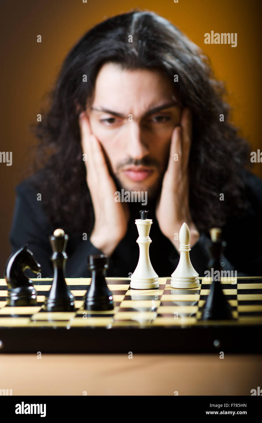 Chess player playing his game Stock Photo - Alamy