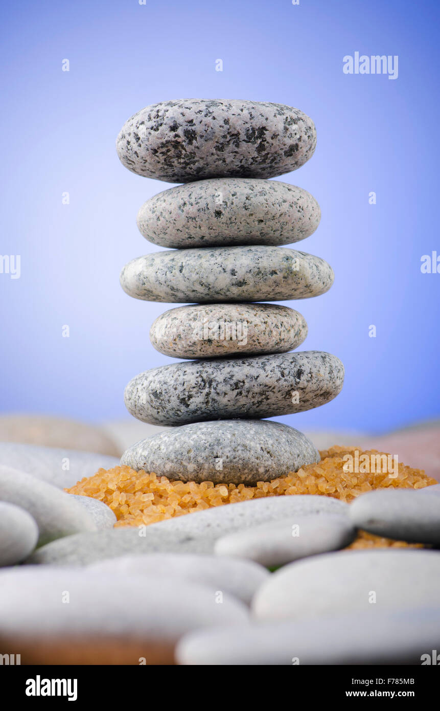Balanced pebbles with colour background Stock Photo - Alamy