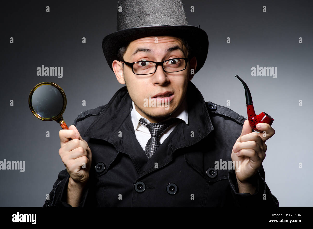 Funny detective with pipe and hat Stock Photo - Alamy