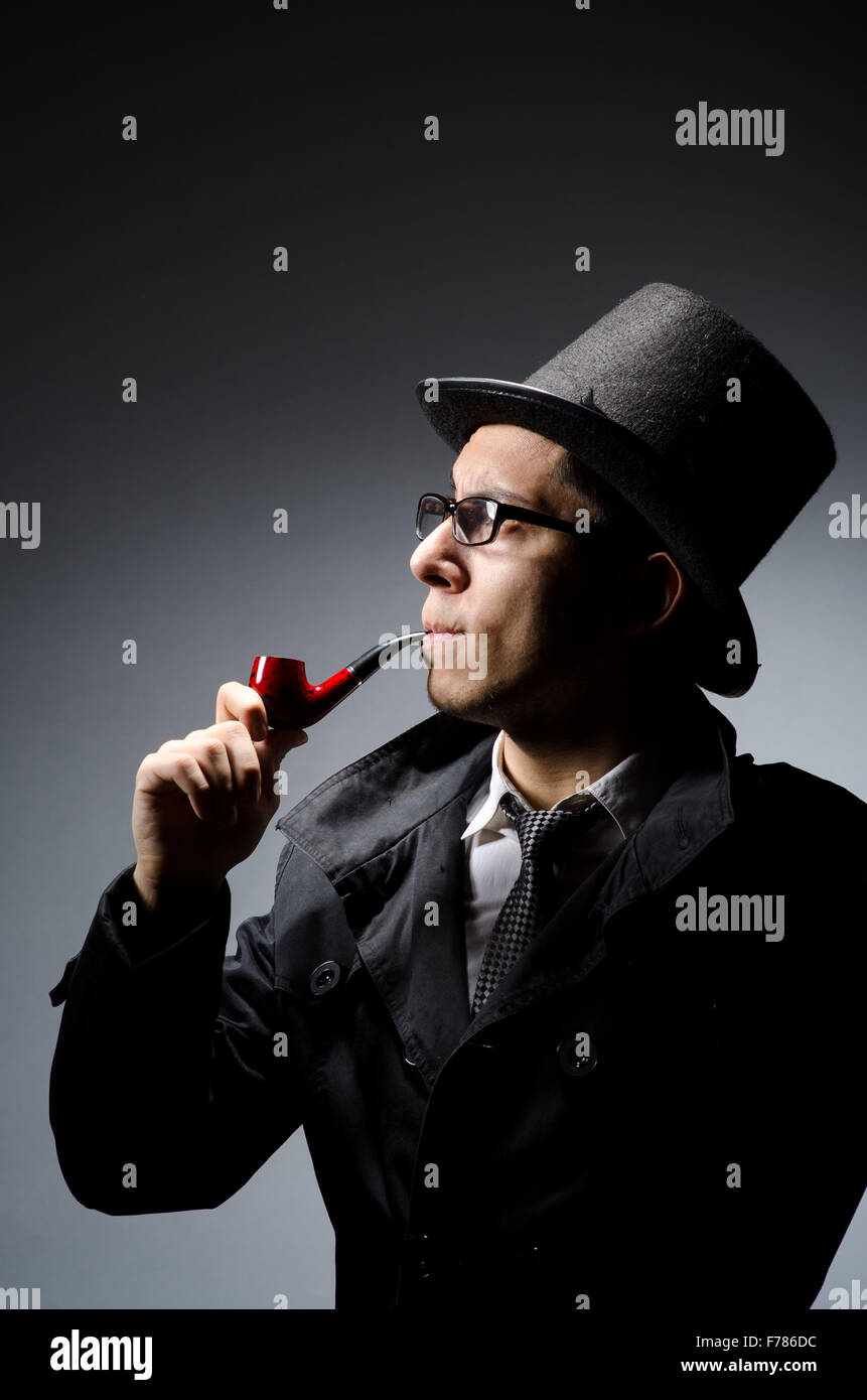 Funny detective with pipe and hat Stock Photo - Alamy