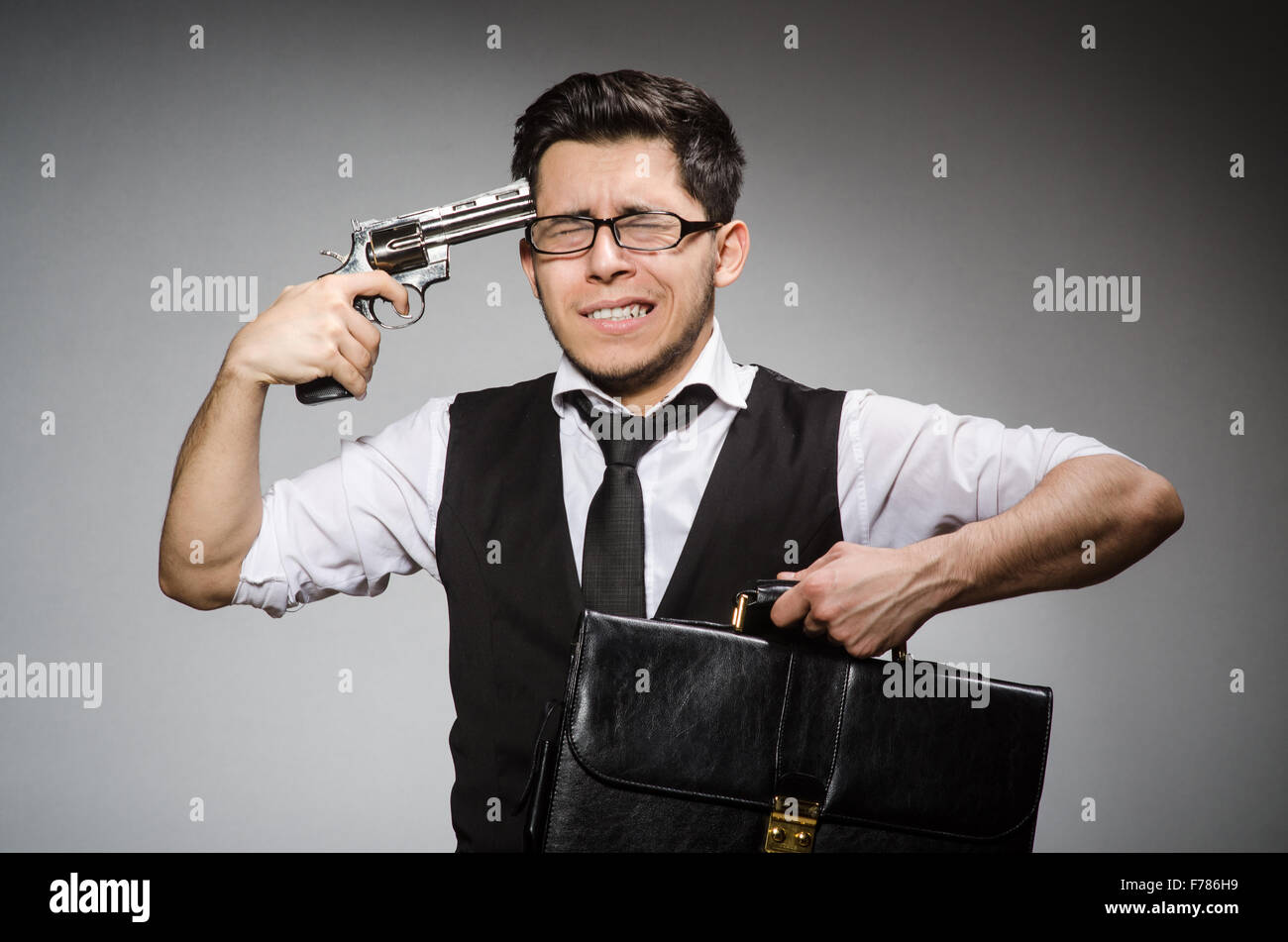 Man with gun and briefcase Stock Photo - Alamy
