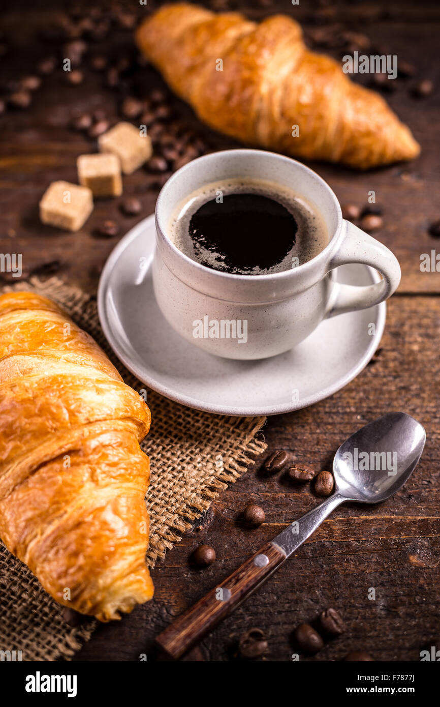 Croissant and coffee on vintage style Stock Photo - Alamy