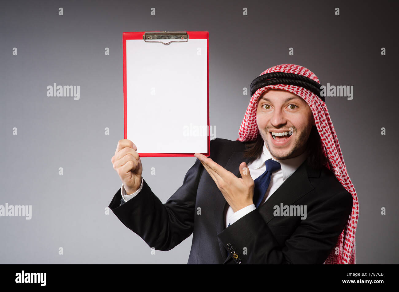 Arab man with paper binder Stock Photo - Alamy