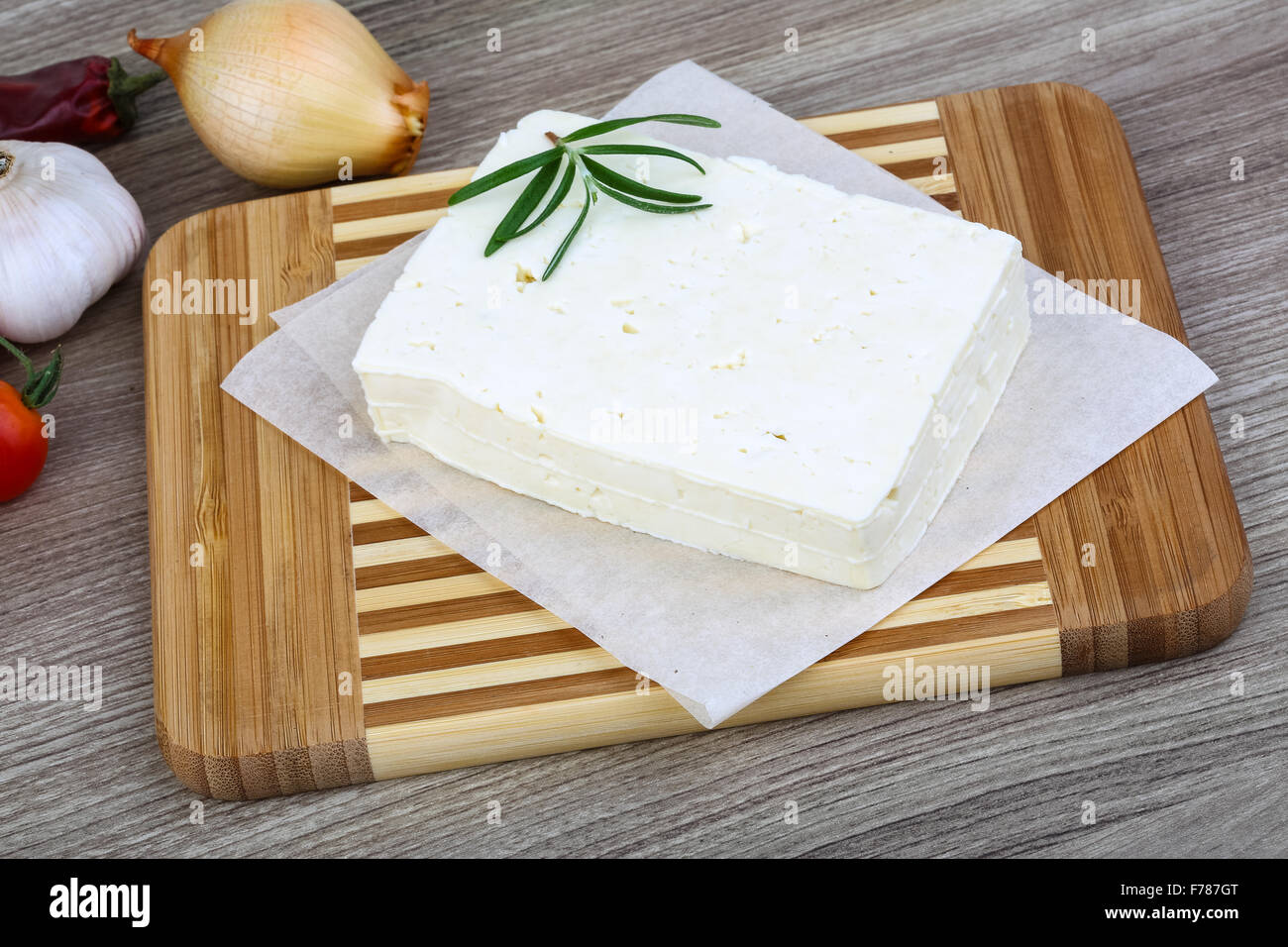 Traditional Caucasian homemade Cheese Brinza with rosemary on wood ...