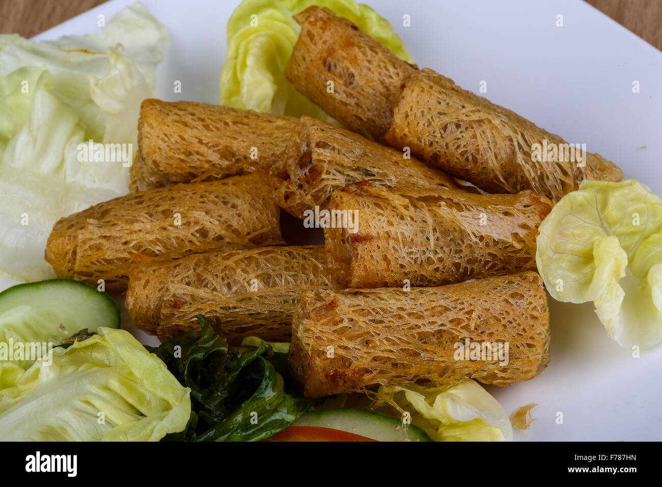 Asian traditional spring rolls on the wood background Stock Photo - Alamy