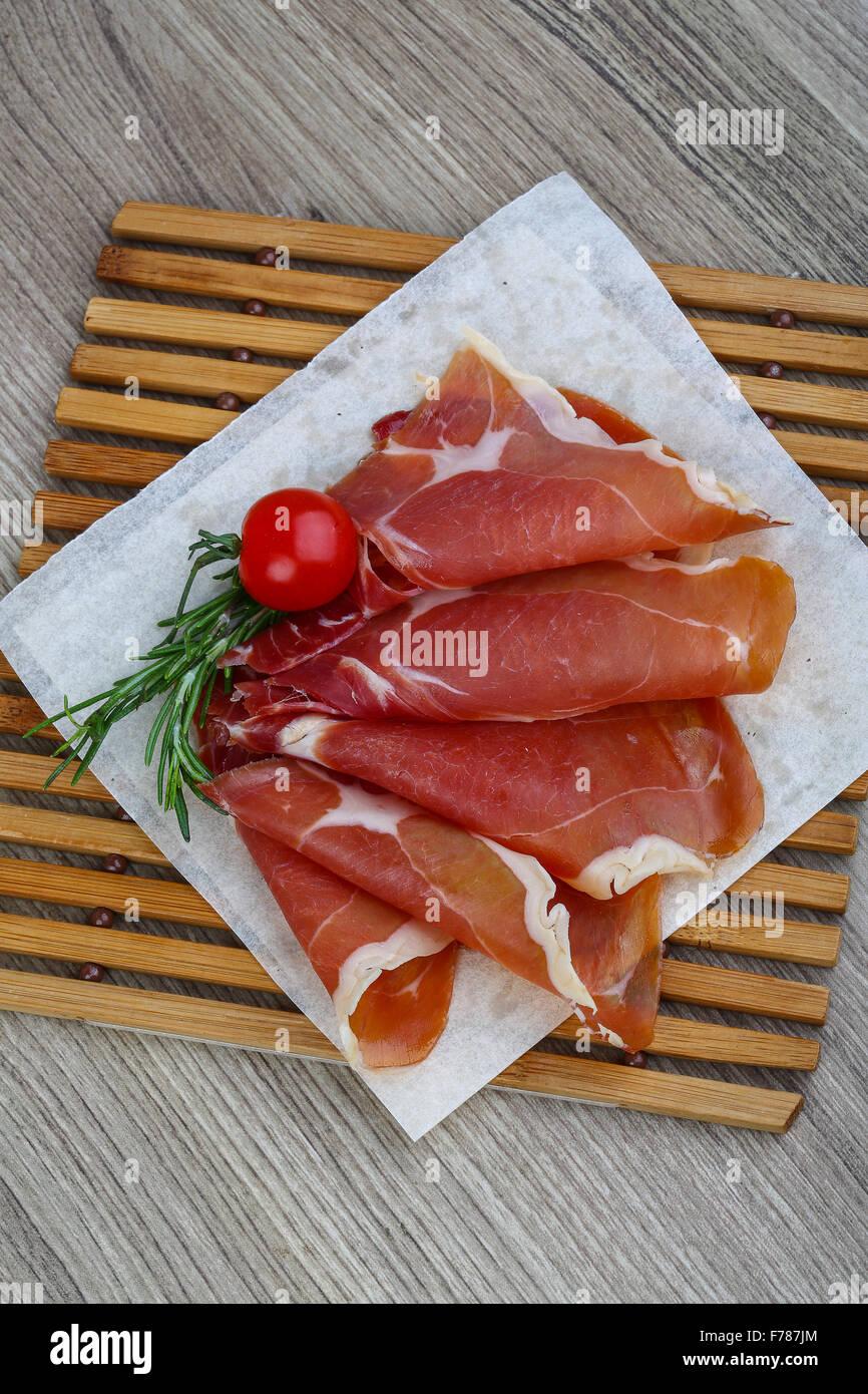Spanish traditional snack - Jamon with tomato and rosemary Stock Photo ...