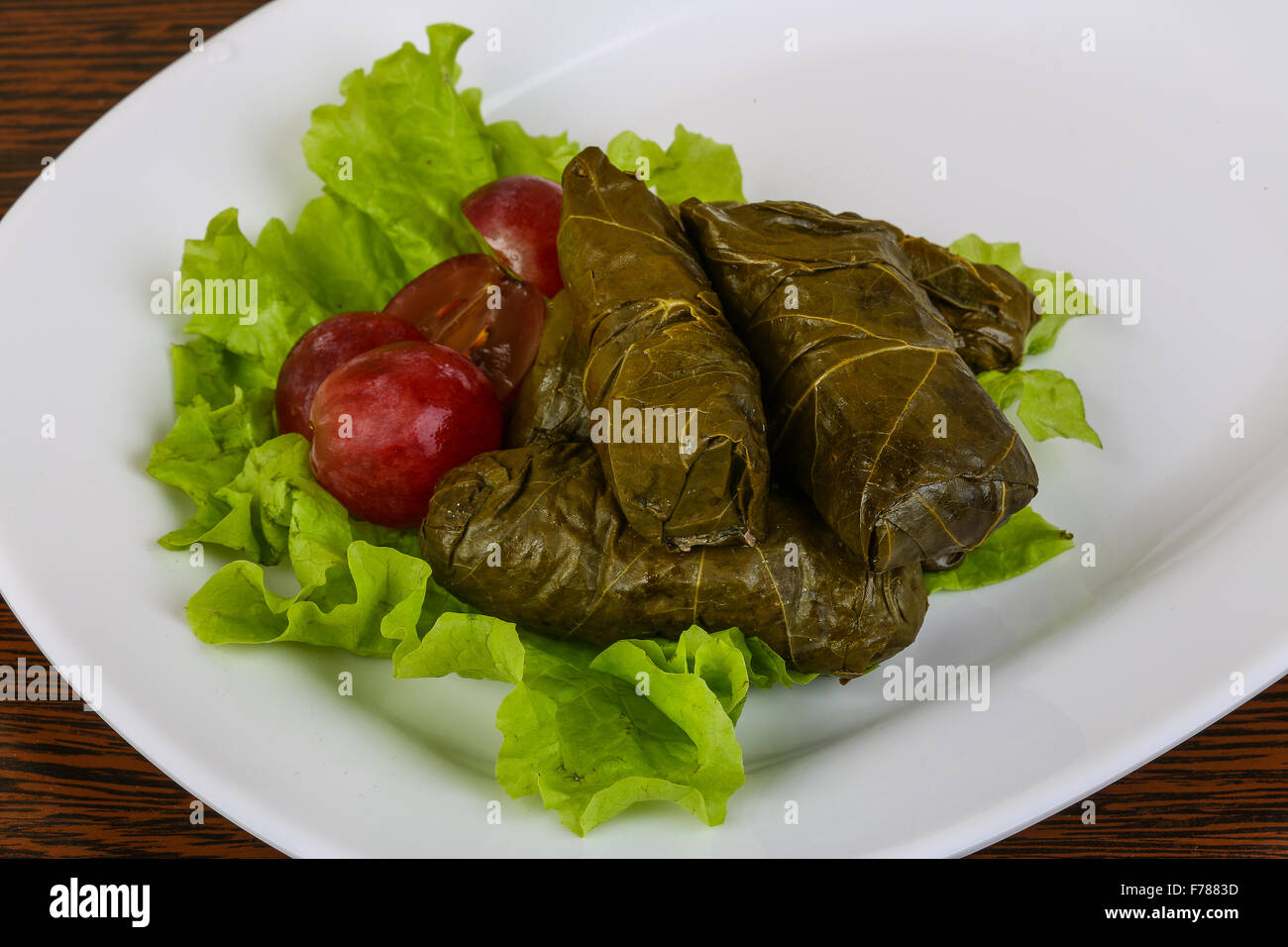 Dolma - minced meat in grape leaves with salad Stock Photo - Alamy