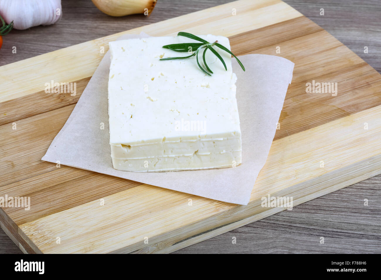 Traditional Caucasian homemade Cheese Brinza with rosemary on wood ...
