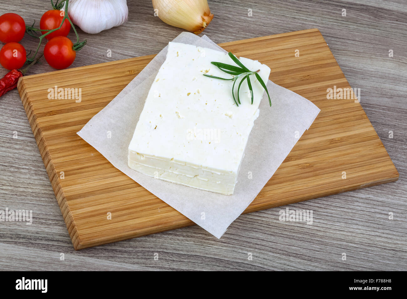 Traditional Caucasian homemade Cheese Brinza with rosemary on wood ...