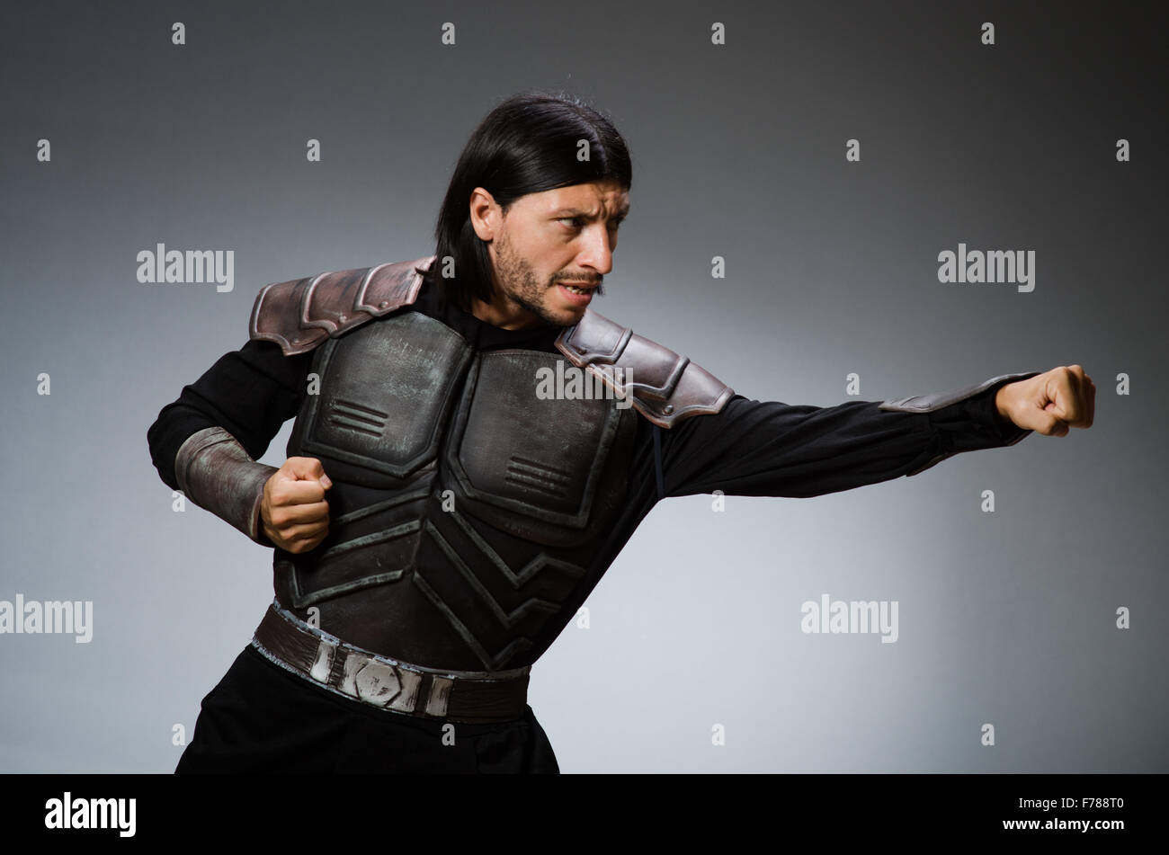 Angry warrior against dark background Stock Photo - Alamy