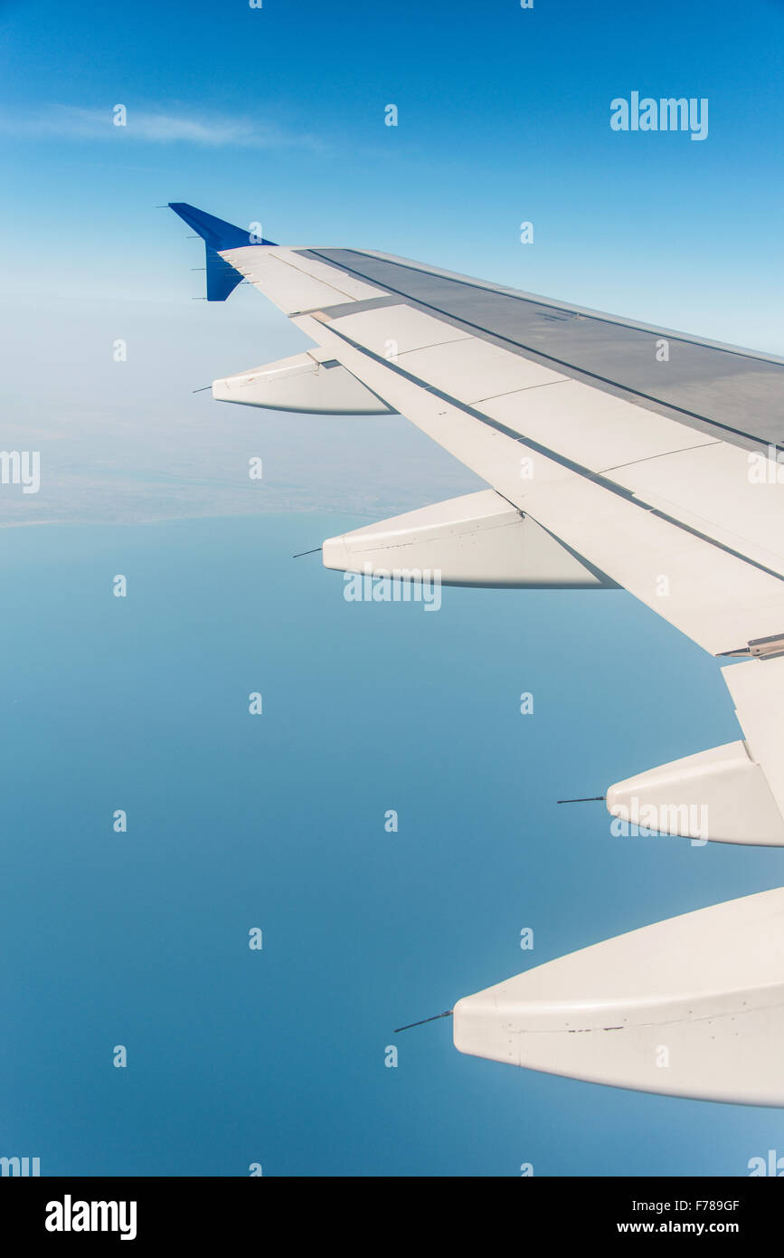 Airplane wing out of window Stock Photo - Alamy