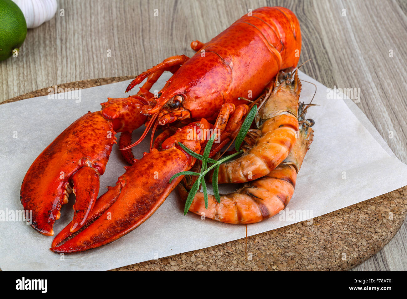 Big cooked lobster and tiger shrimps ready for eating Stock Photo - Alamy