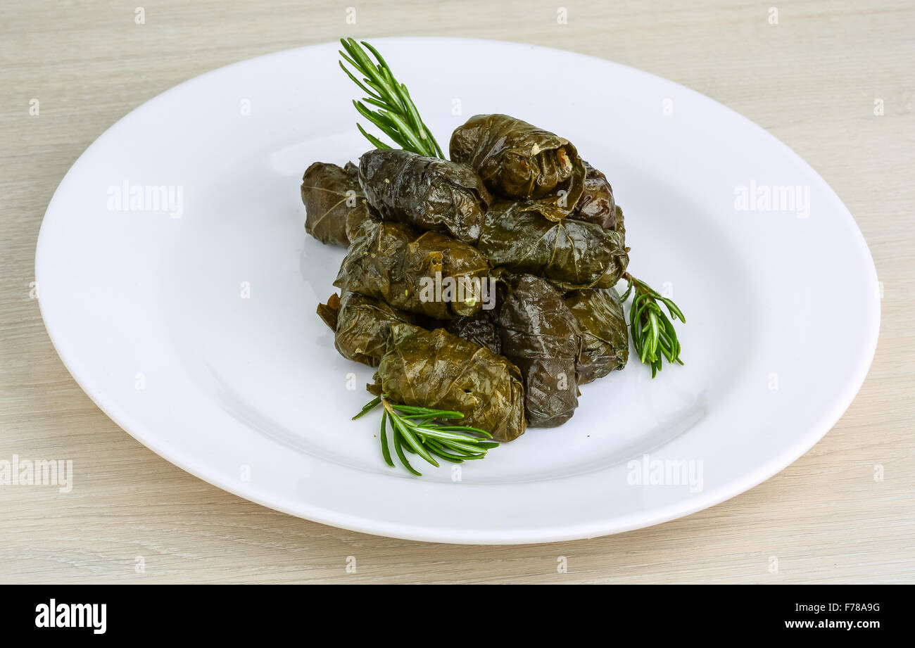 Greek dolma in grape leaves with meat served rosemary Stock Photo - Alamy