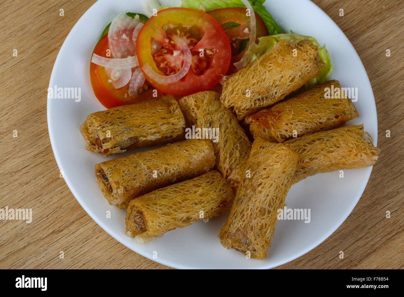 Asian traditional spring rolls on the wood background Stock Photo - Alamy
