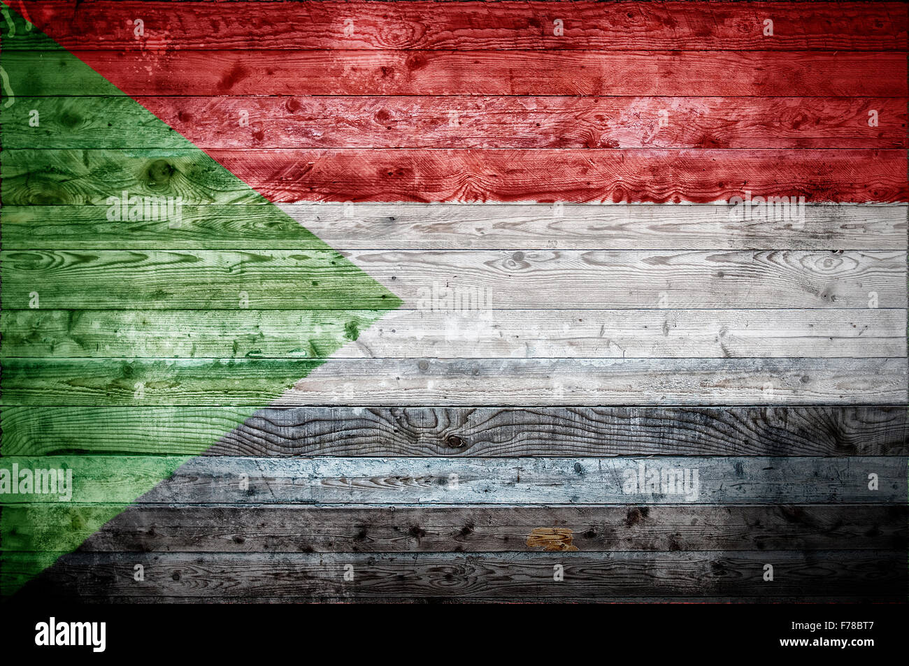 A vignetted background image of the flag of Sudan onto wooden boards of ...