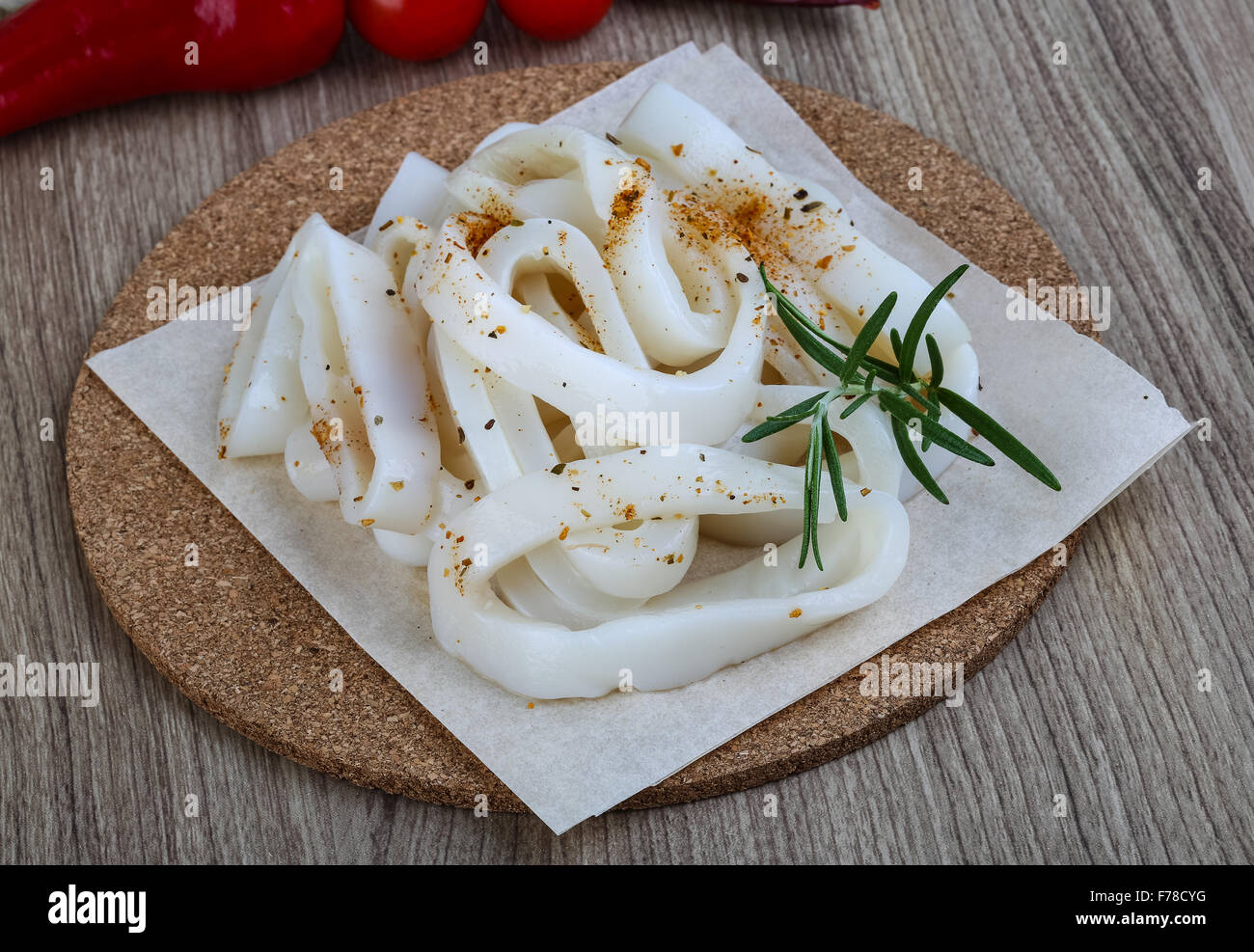 Raw squid rings with herbs - ready for cooking Stock Photo - Alamy