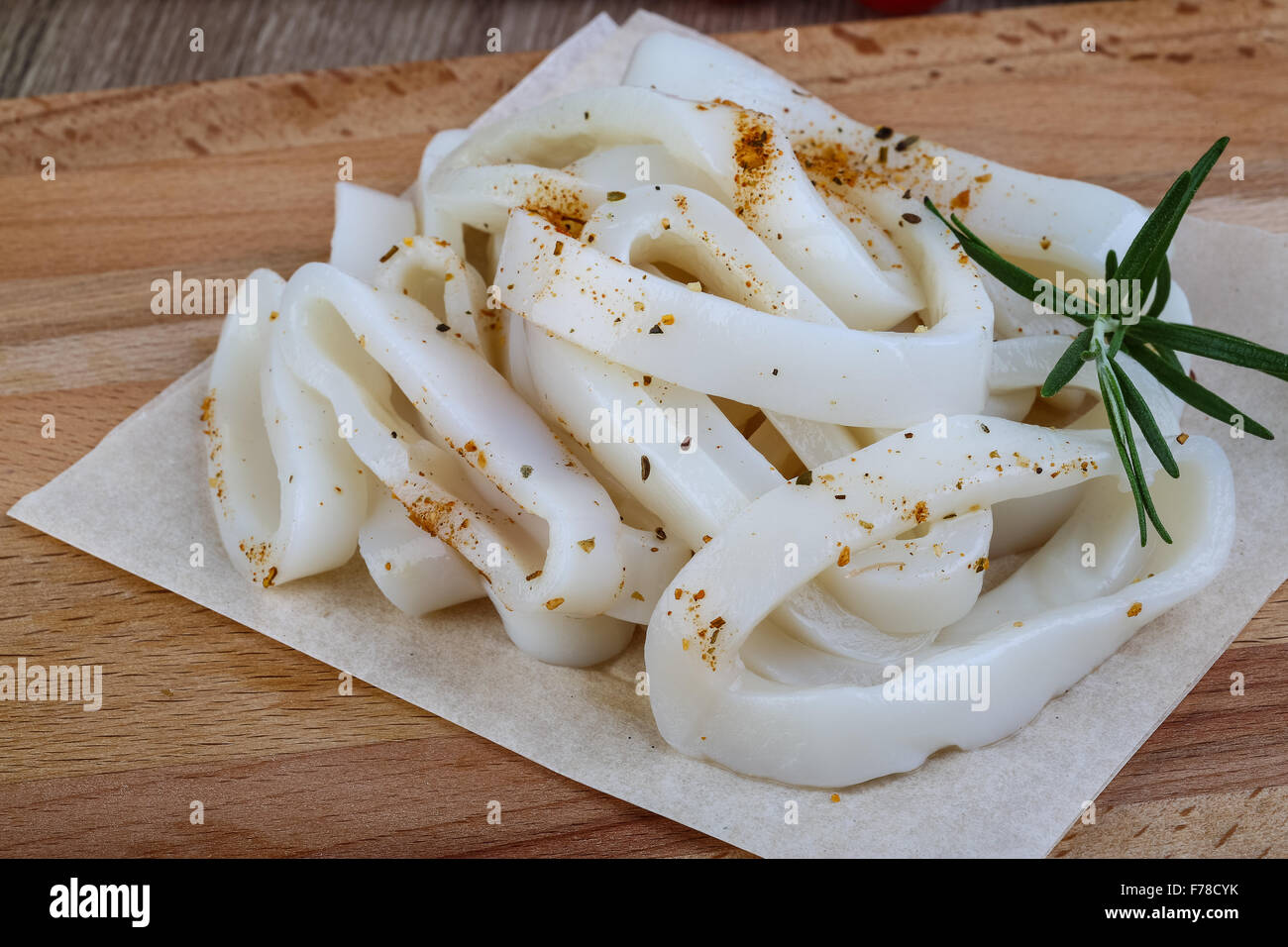 Raw squid rings with herbs - ready for cooking Stock Photo - Alamy