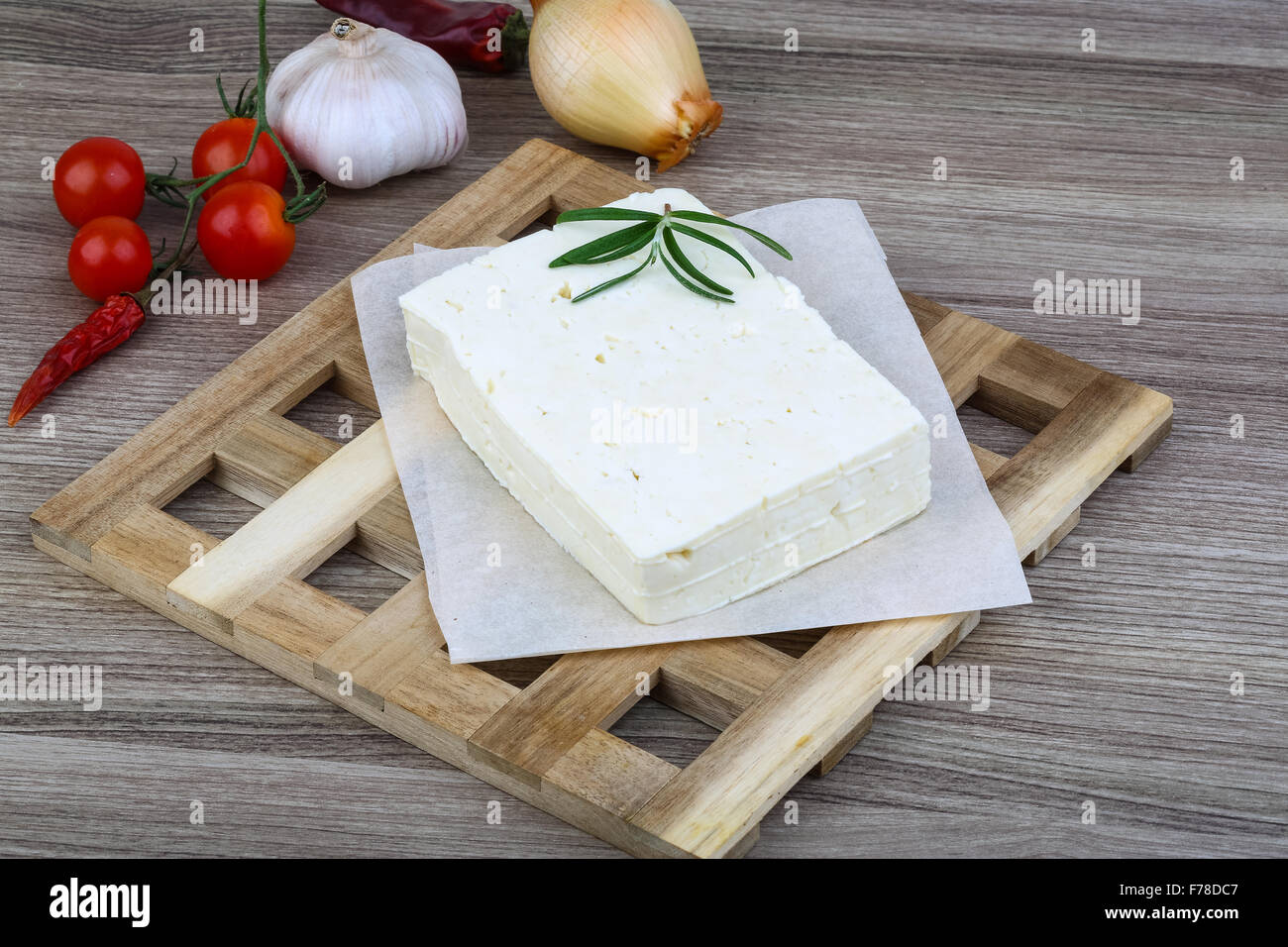 Traditional Caucasian homemade Cheese Brinza with rosemary on wood ...