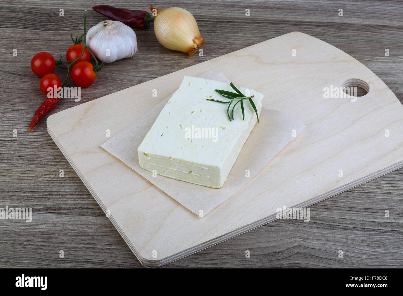 Traditional Caucasian homemade Cheese Brinza with rosemary on wood ...