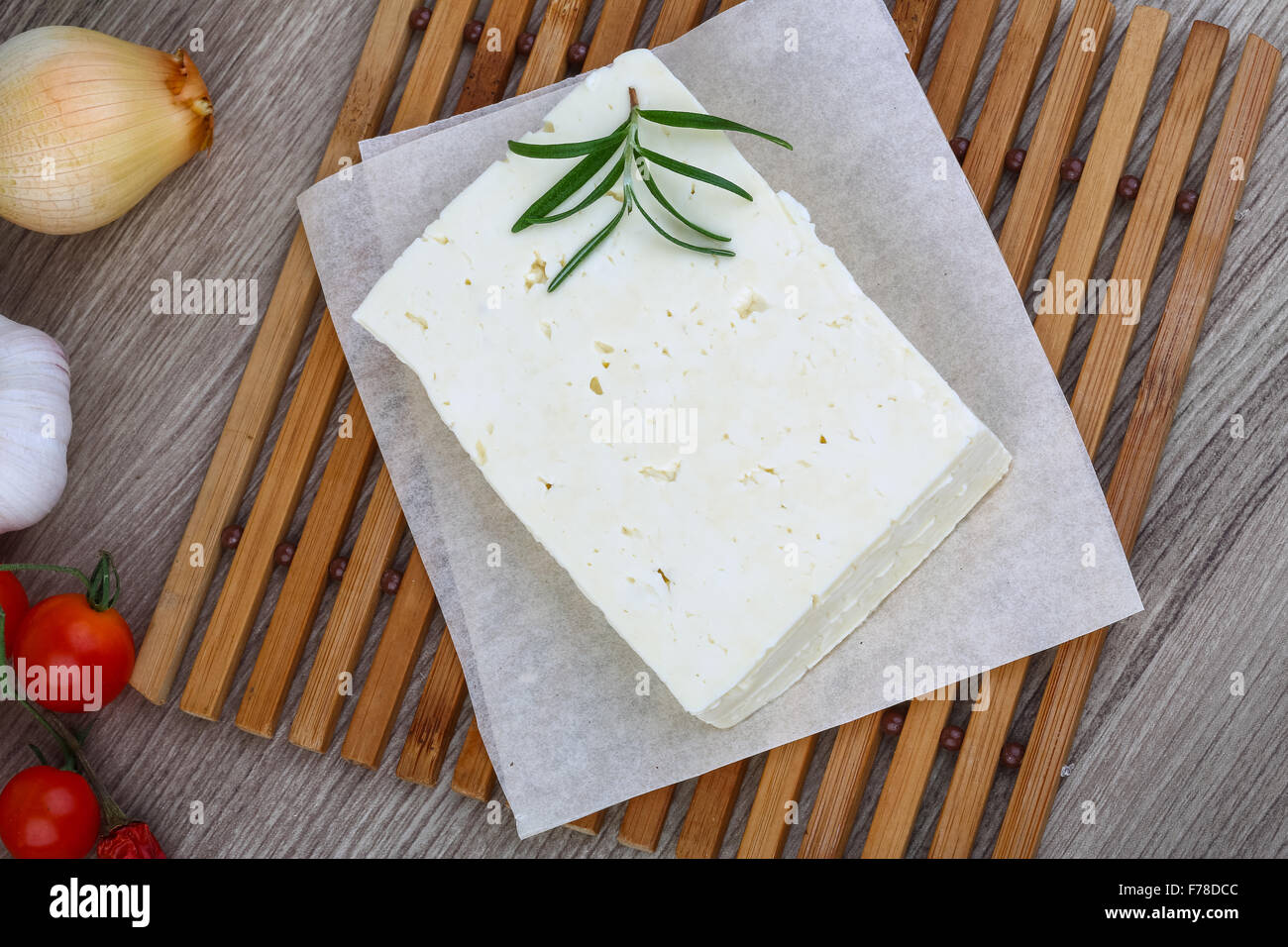 Traditional Caucasian homemade Cheese Brinza with rosemary on wood ...