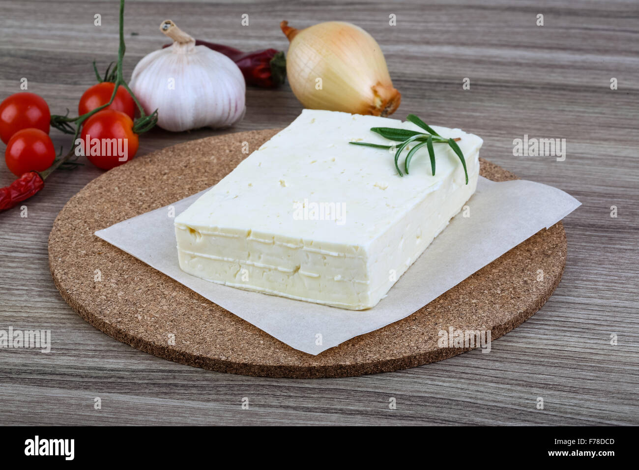 Traditional Caucasian homemade Cheese Brinza with rosemary on wood ...