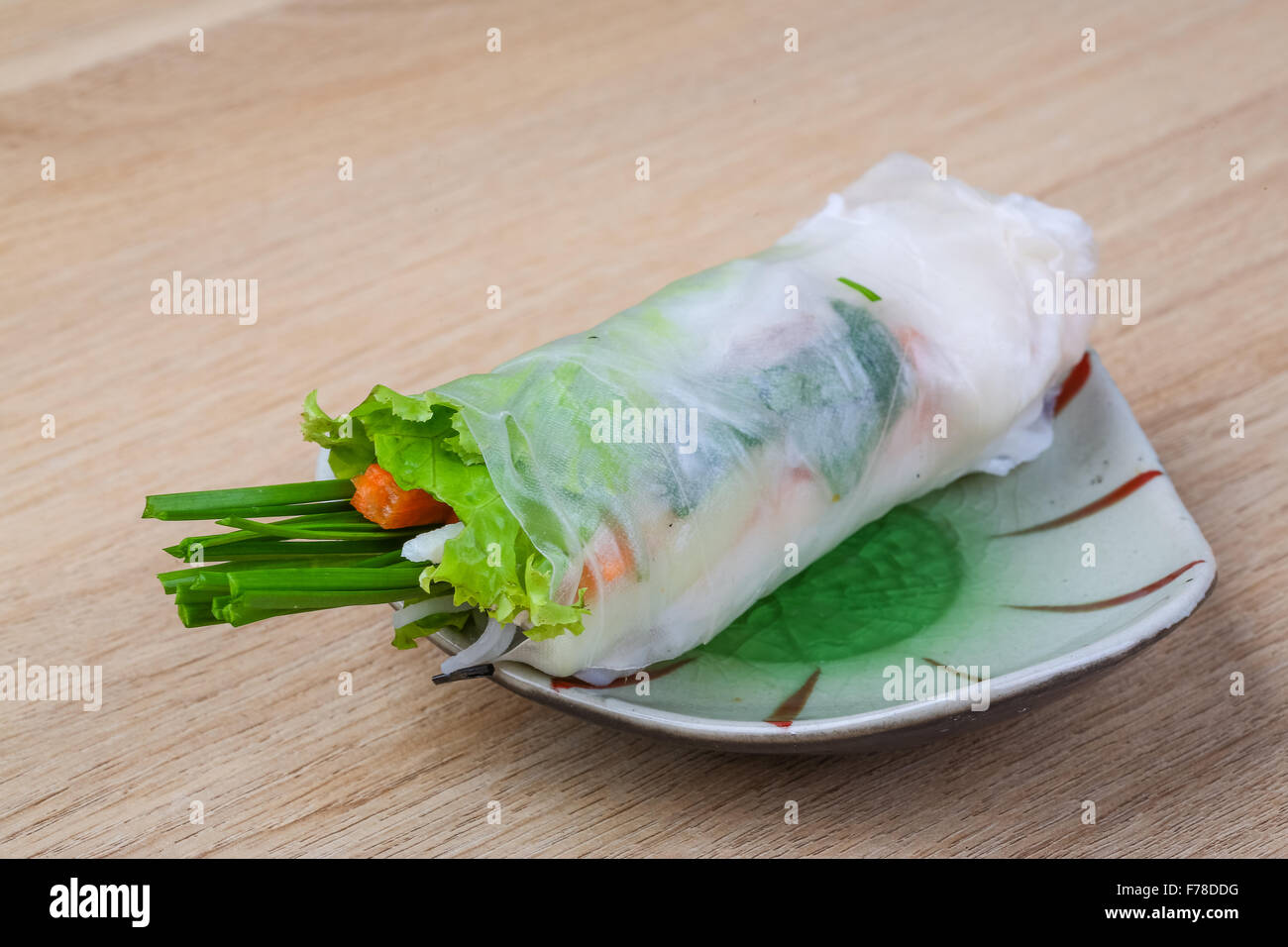 Asian traditional spring rolls on the wood background Stock Photo - Alamy