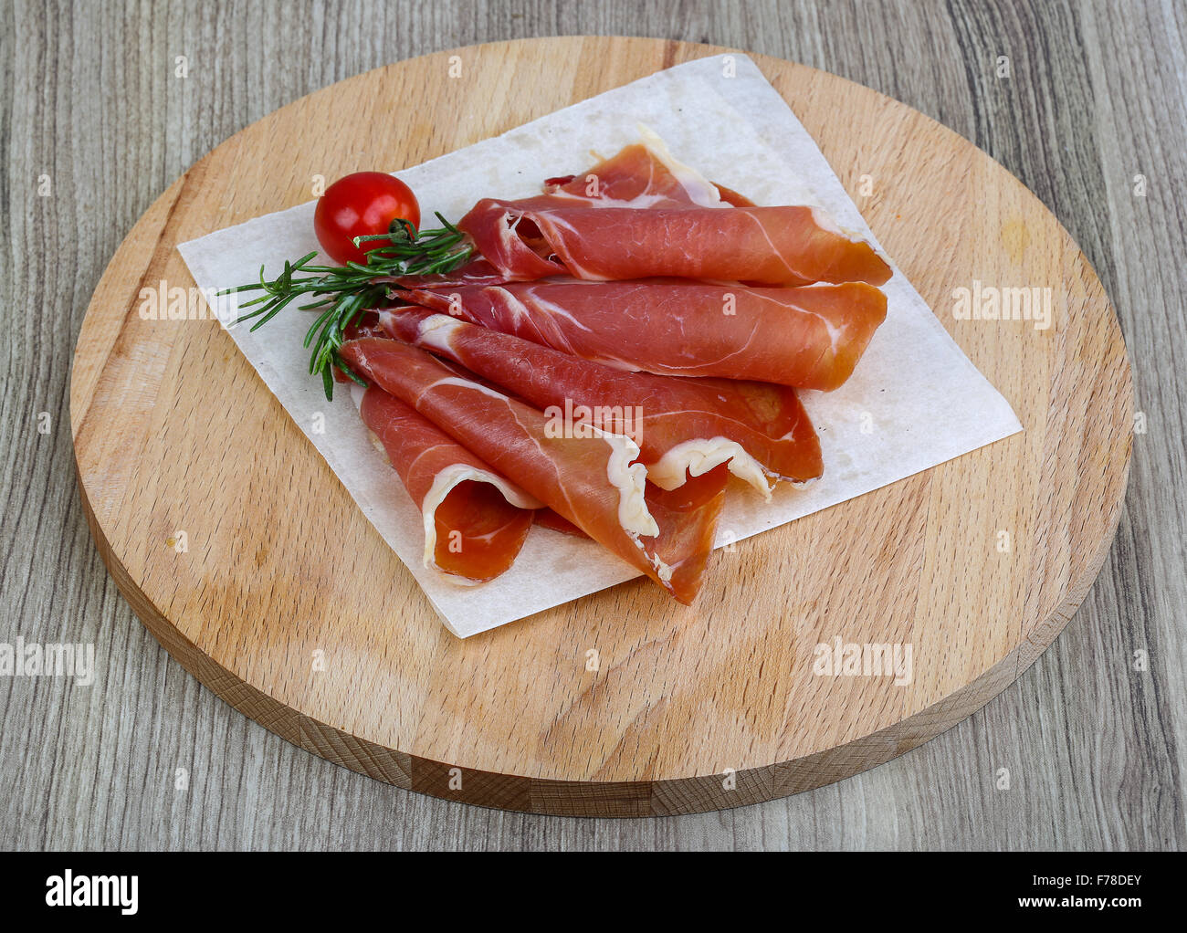 Spanish traditional snack - Jamon with tomato and rosemary Stock Photo ...