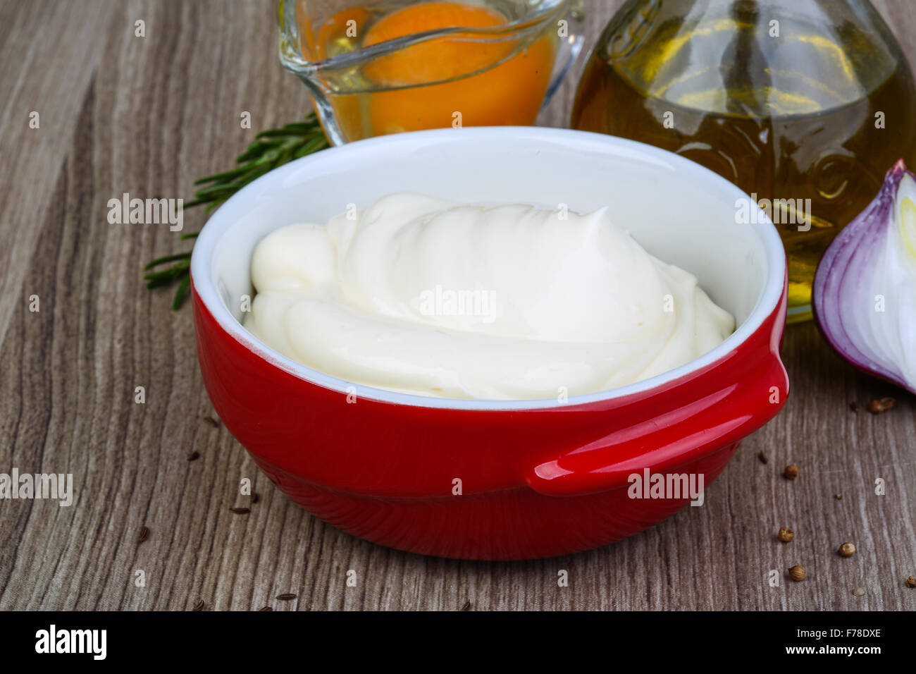 Mayonnaise sauce served raw egg, olive oil and rosemary Stock Photo - Alamy