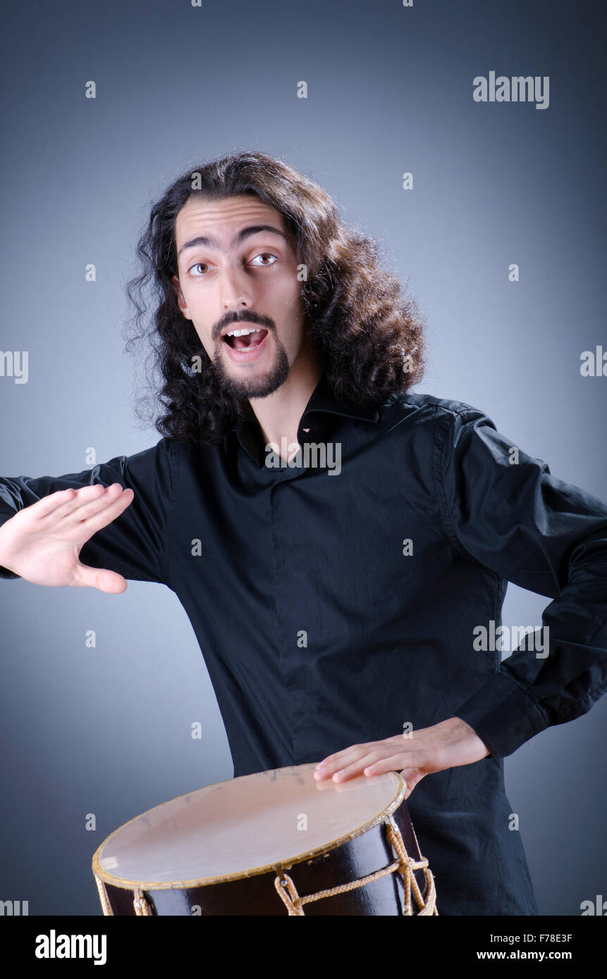 Man playing drum in studio Stock Photo - Alamy
