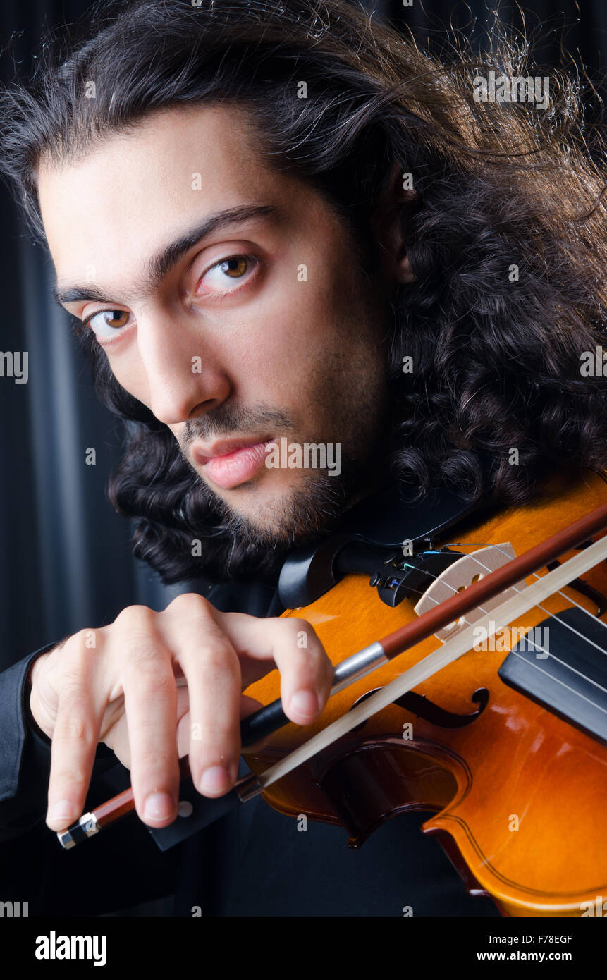 Young violin player playing Stock Photo - Alamy