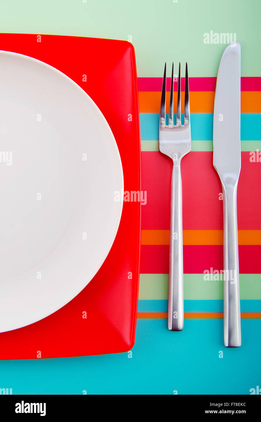 Empty plate with utensils Stock Photo - Alamy
