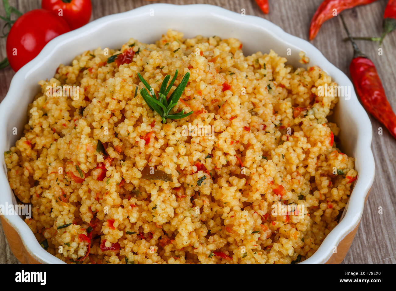 Arabic traditional cuisine - Couscous with tomato and green onion Stock ...