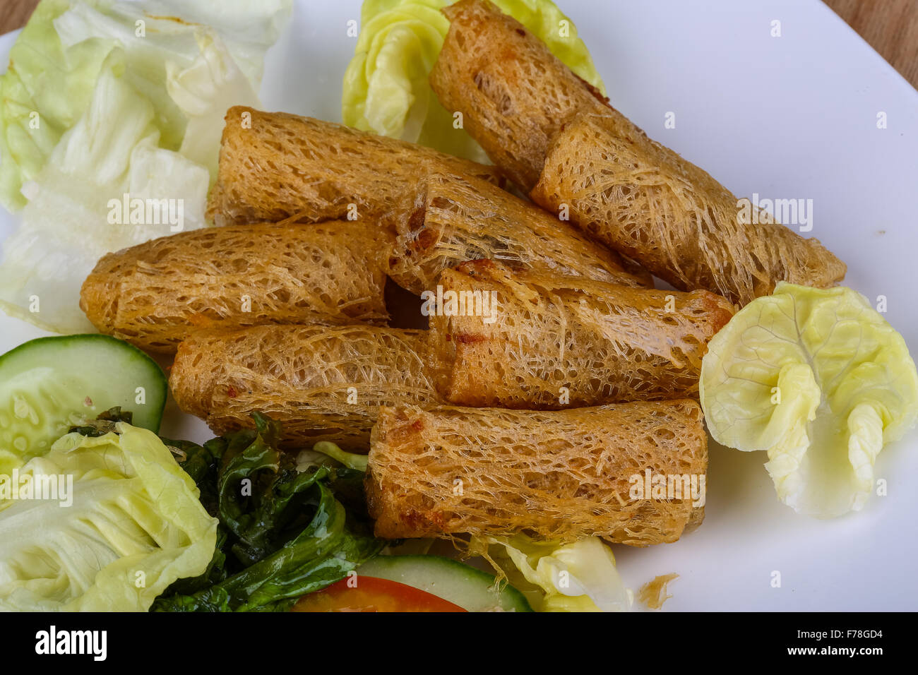 Asian traditional spring rolls on the wood background Stock Photo - Alamy