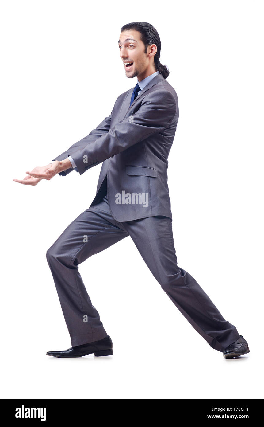 Young businessman pushing invisible obstacles Stock Photo - Alamy