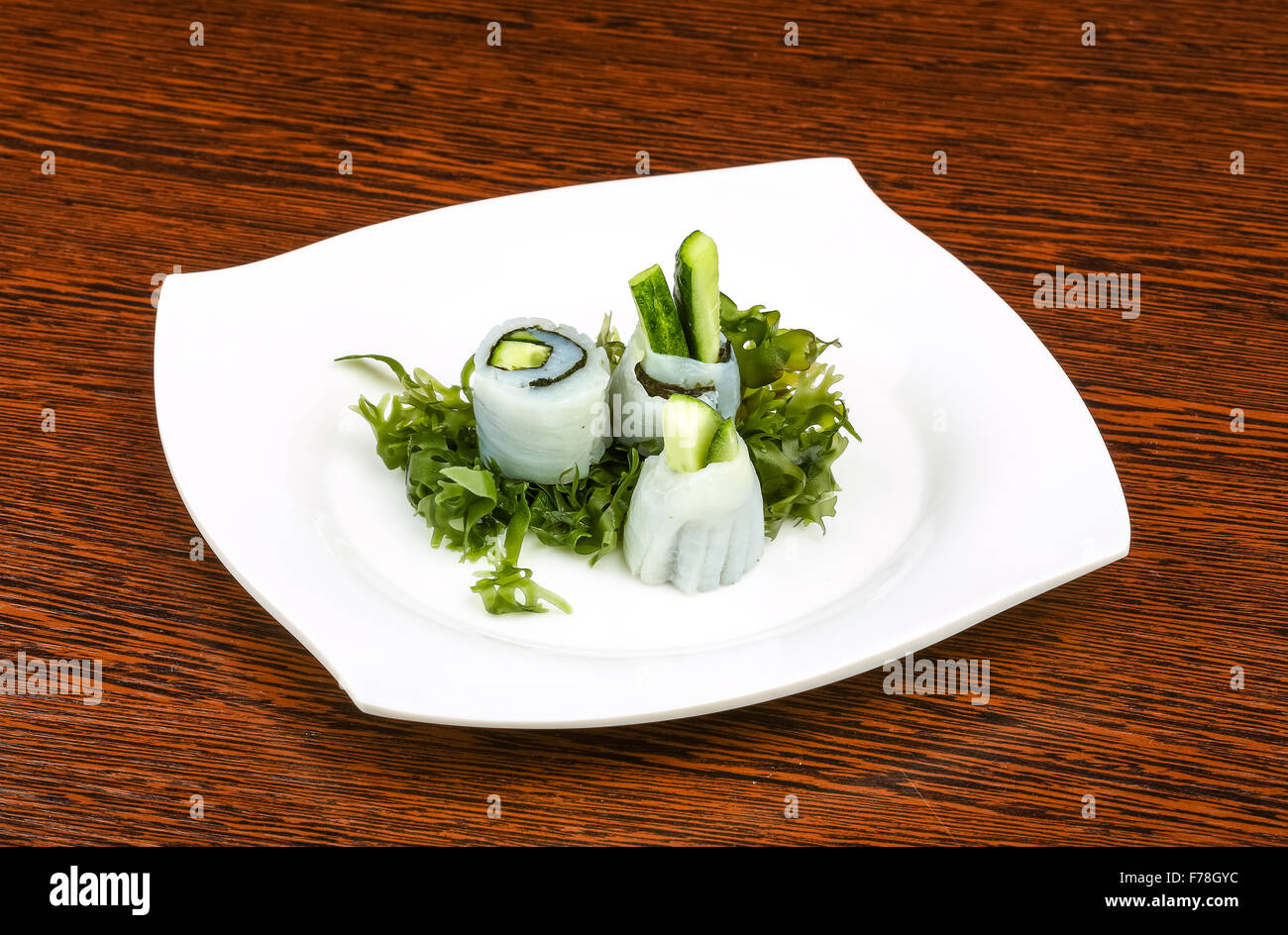 Fresh cold Squid sashimi with cucumber and nori Stock Photo - Alamy