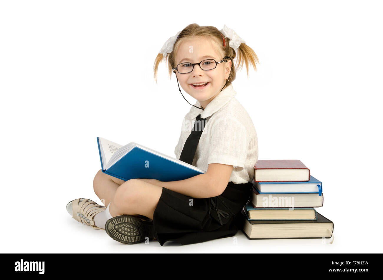 Little girl with books on white Stock Photo - Alamy