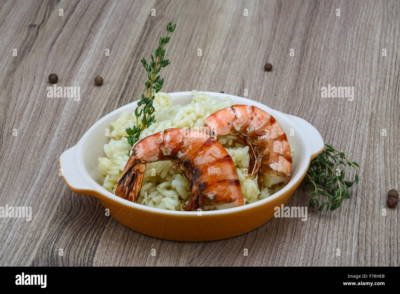Italian trditional Risotto with tiger prawn and thyme Stock Photo - Alamy