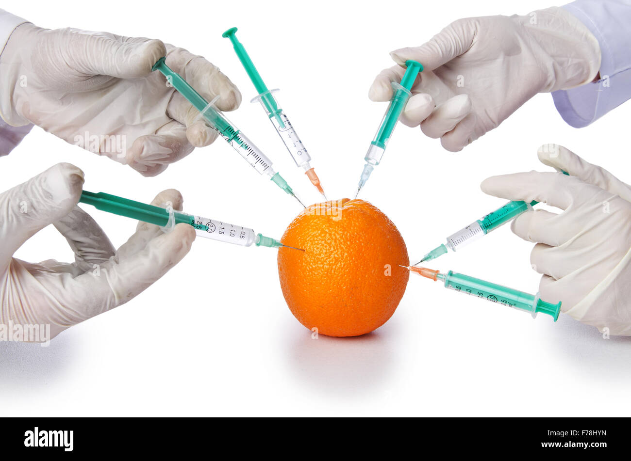 Science experiment with orange and syringe Stock Photo - Alamy