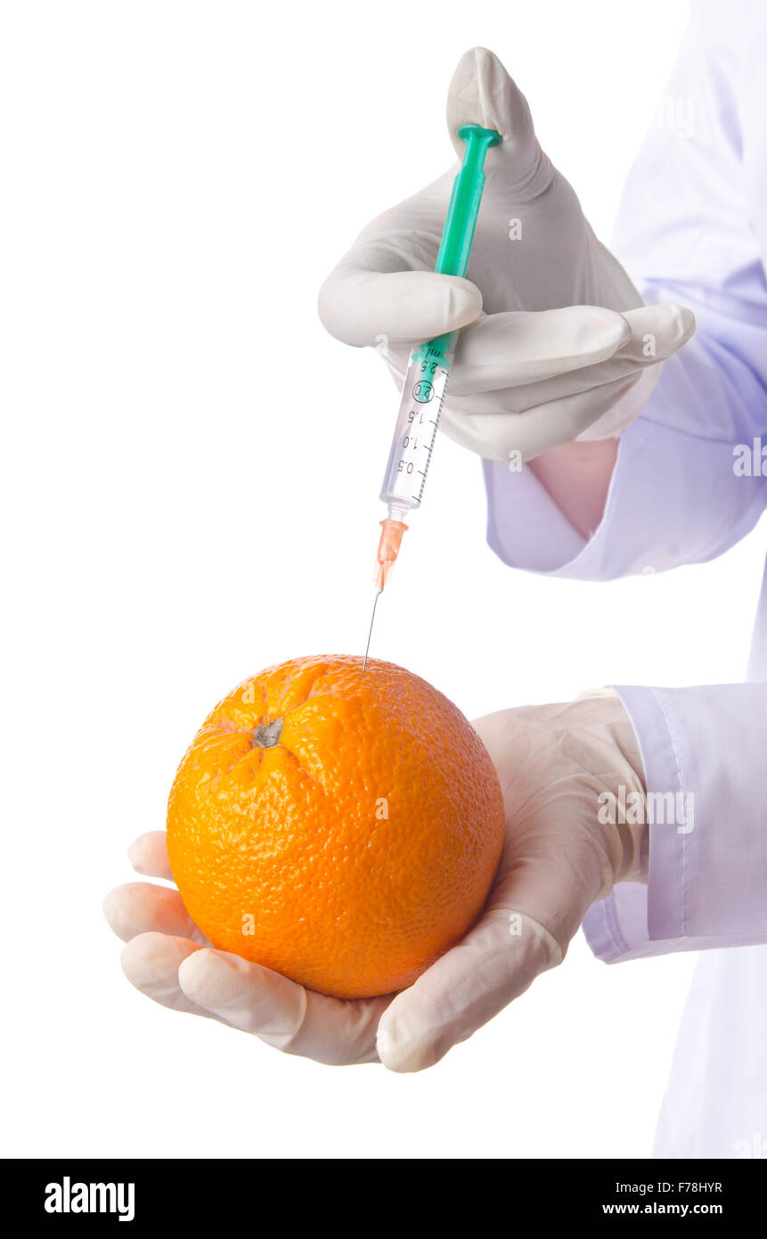 Science experiment with orange and syringe Stock Photo - Alamy